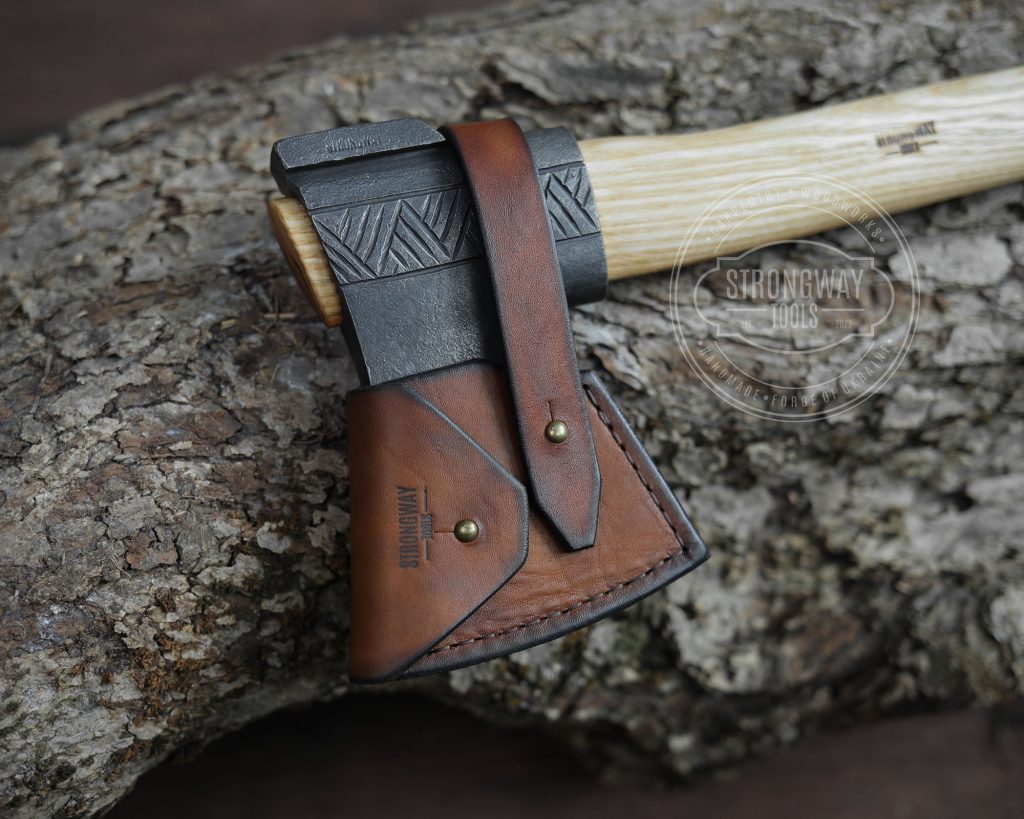 Finnish ax with ornament on the head